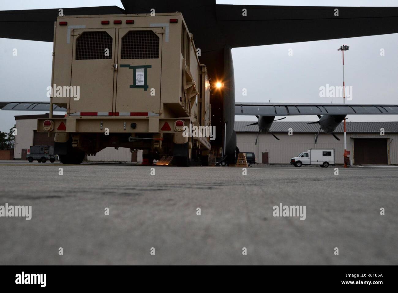 The Tactical Air Navigation system rests outside a C-130 aircraft April ...