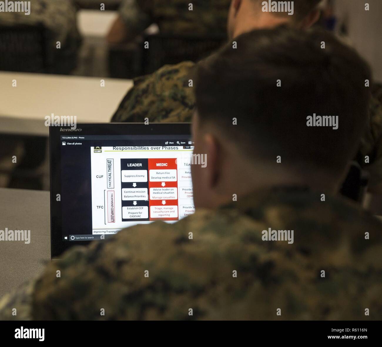 A Marine follows the class lesson during a Squad Overmatch lecture at ...