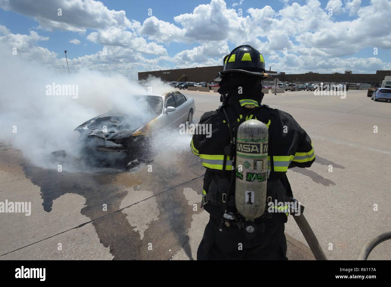 William Green, Tinker Fire and Emergency Services firefighter, sprays ...