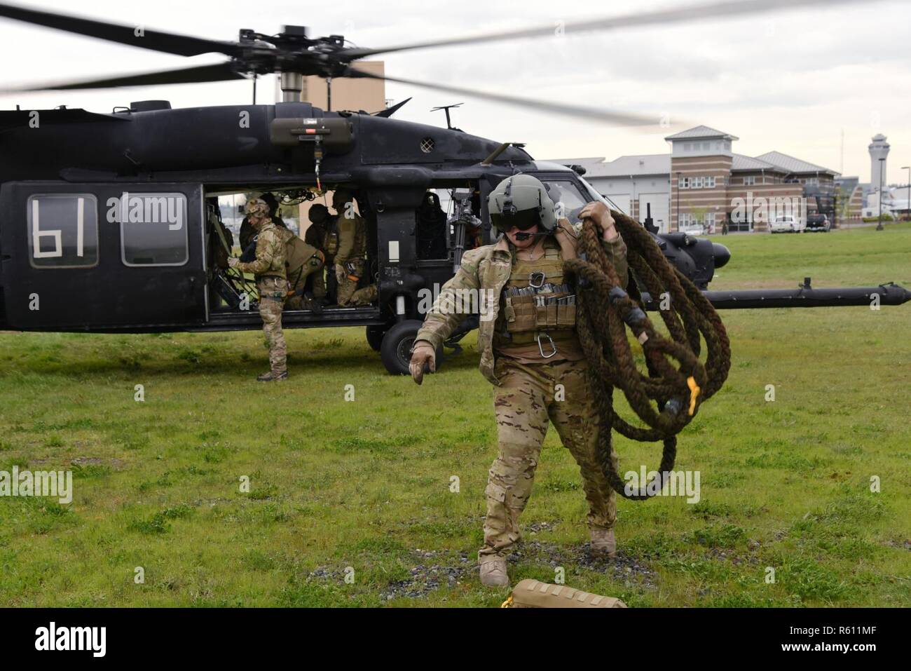 A crew member from the C/4-160th SOAR (Night Stalkers) collects a ...