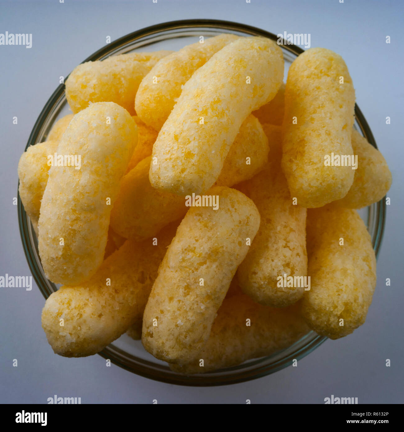 Corn Puffs in a Glass Bowl. Crunchy Flavored Puffed Snacks. Party ...