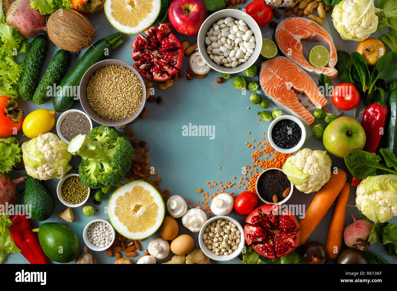 Top view frame of healthy and diet food (cereals, seeds, fish ...