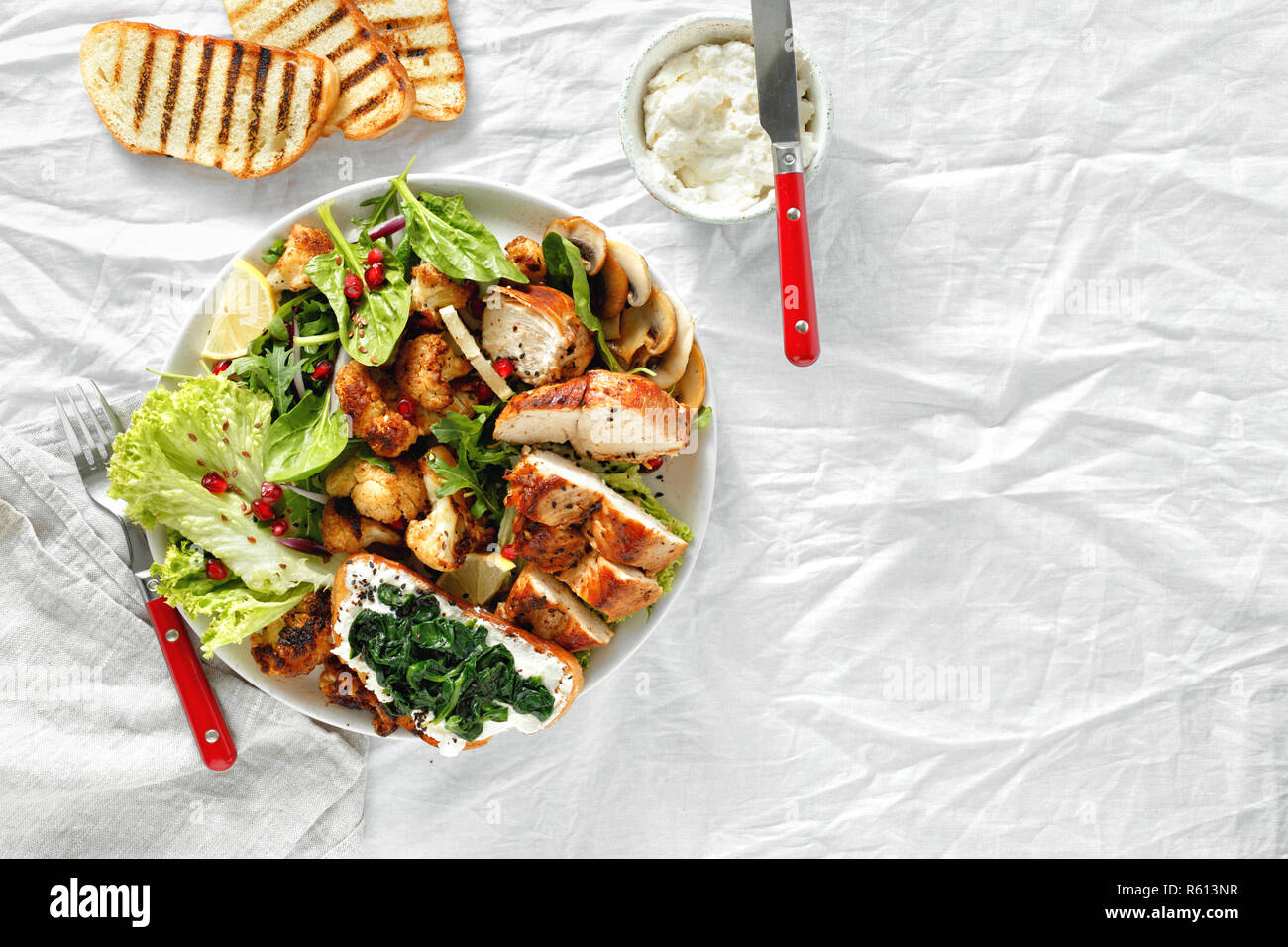 Lunch food bowl of fresh salad with hicken steak and fried cauliflower ...
