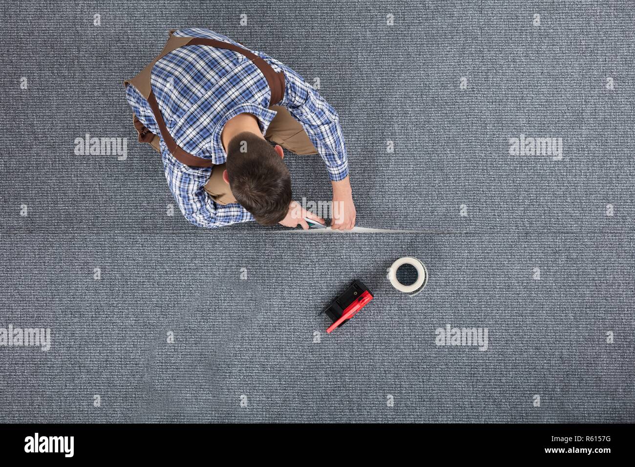 Carpenter Laying Carpet Stock Photo - Alamy