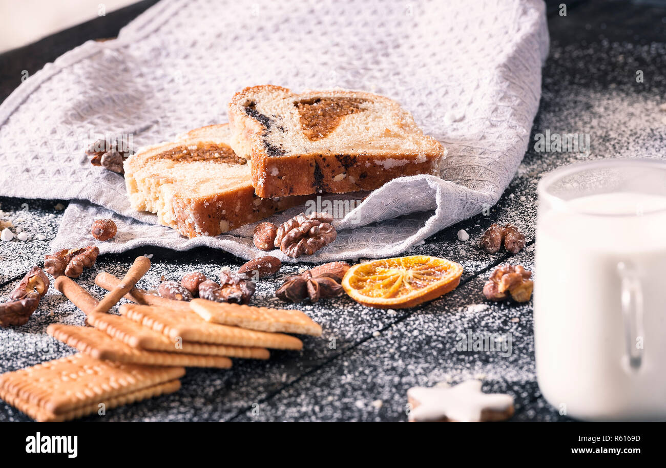Slices of sponge cake and roasted nuts Stock Photo - Alamy
