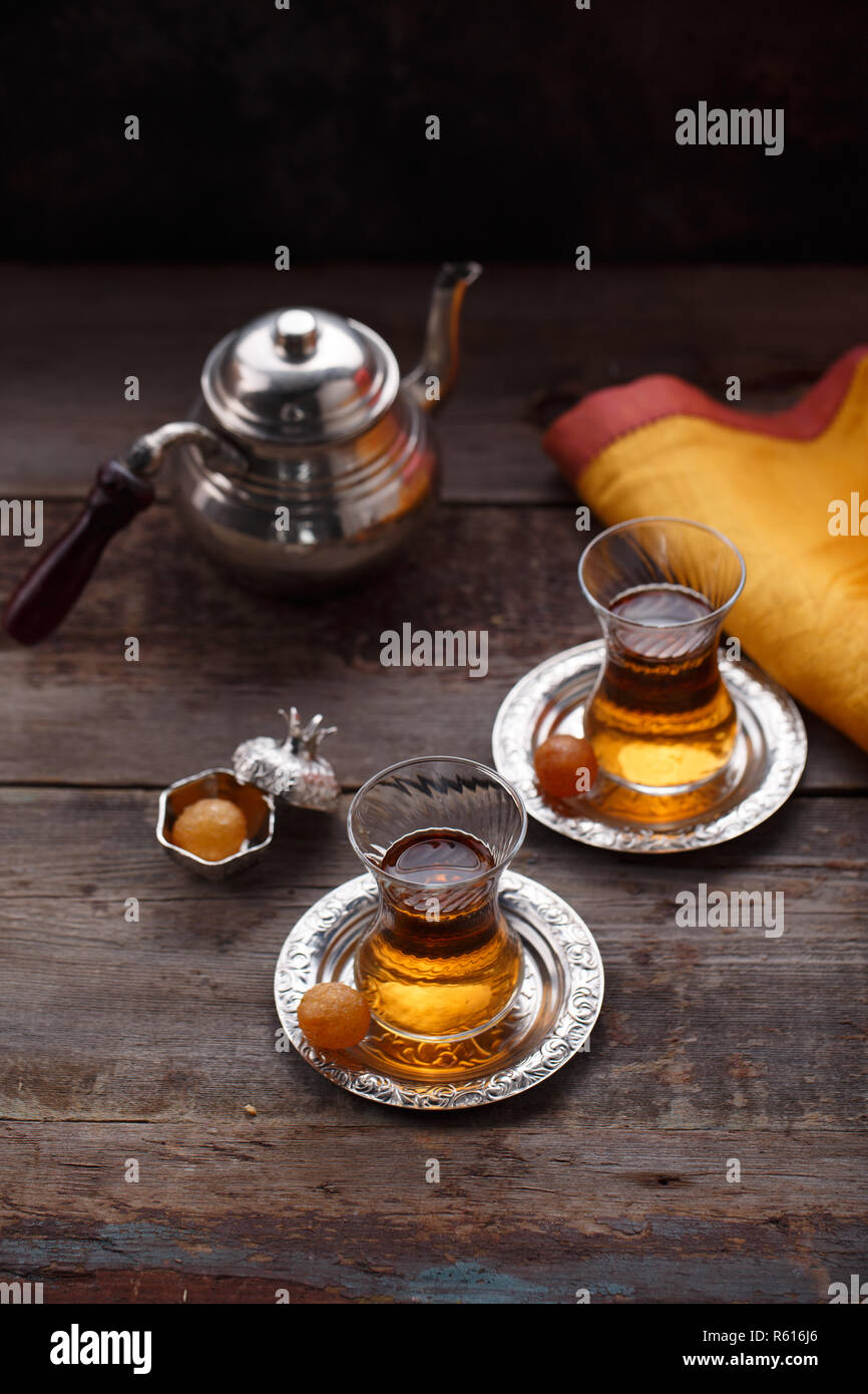 Traditional turkish teapot and cups of tea on woden background Stock ...