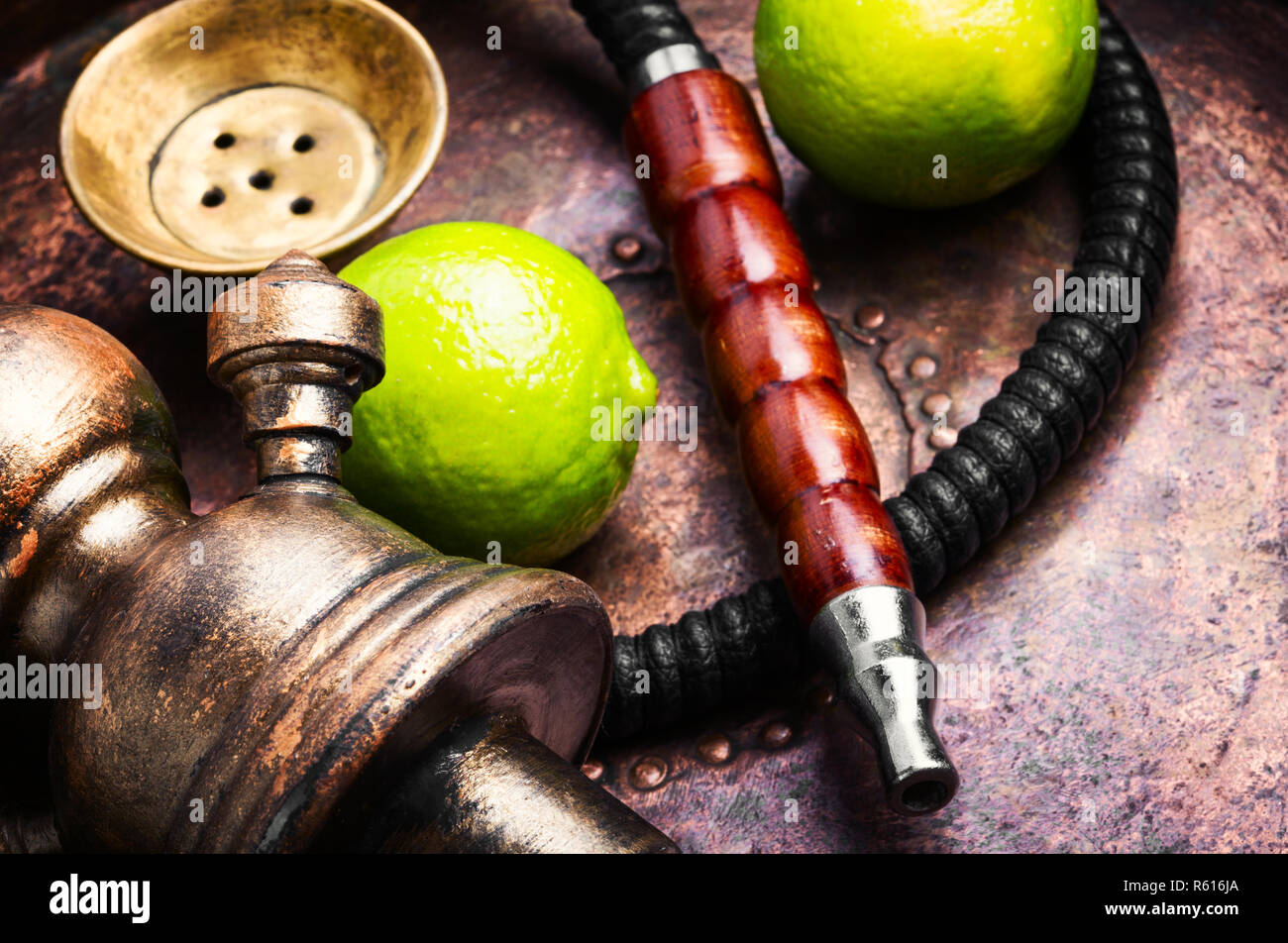 Eastern smoking hookah with mouthpieces with lime flavor.Shisha ...
