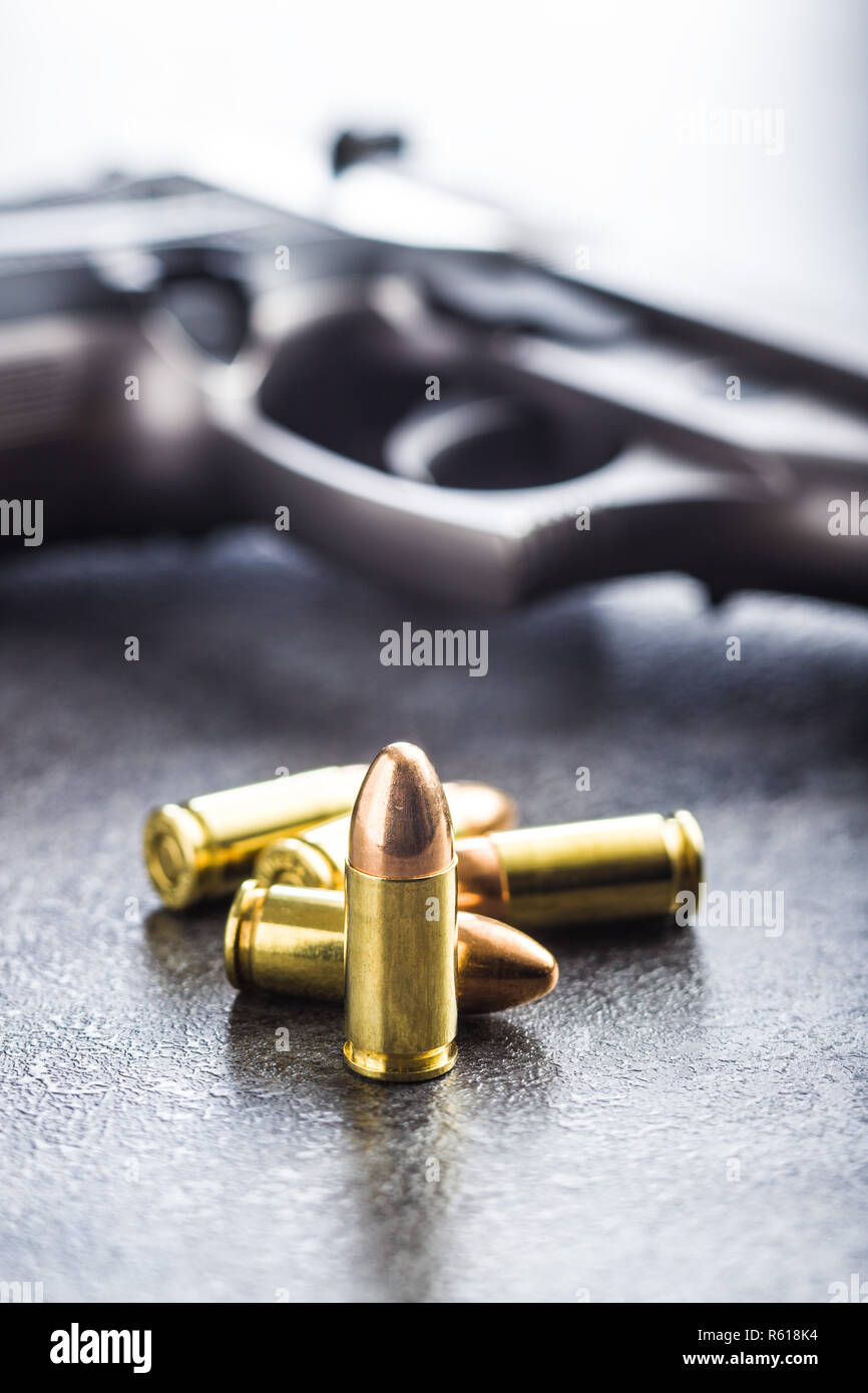 9mm pistol bullets and handgun Stock Photo - Alamy