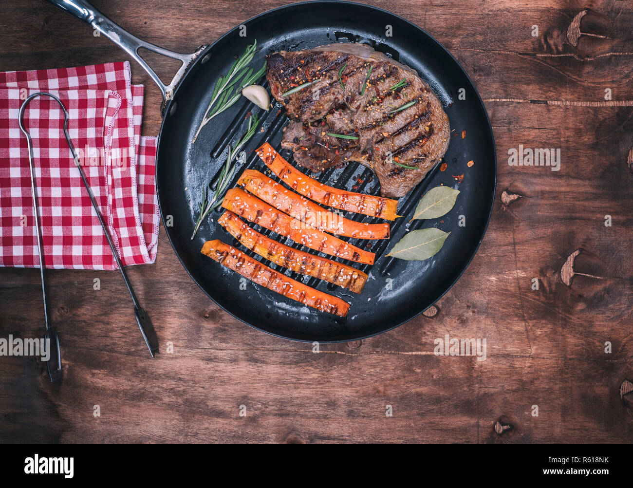 fried beef stack and fried carrots on a round frying pan Stock Photo ...