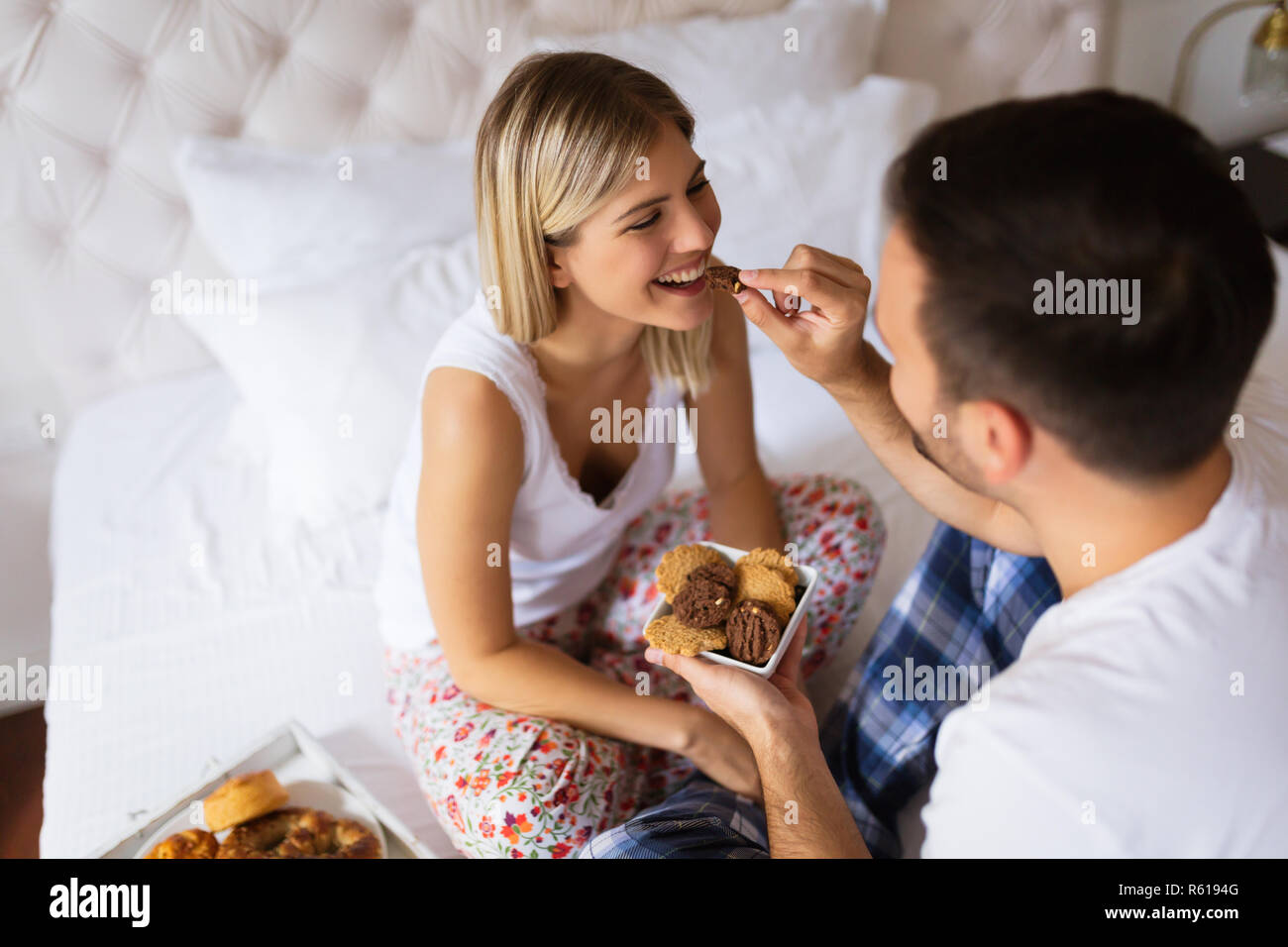 Young couple having having romantic times in bedroom Stock Photo - Alamy