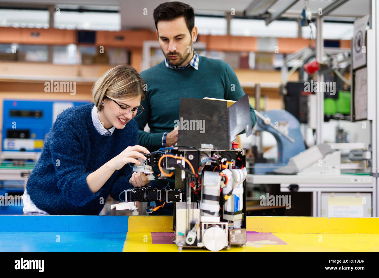 Young students of robotics working on project Stock Photo - Alamy