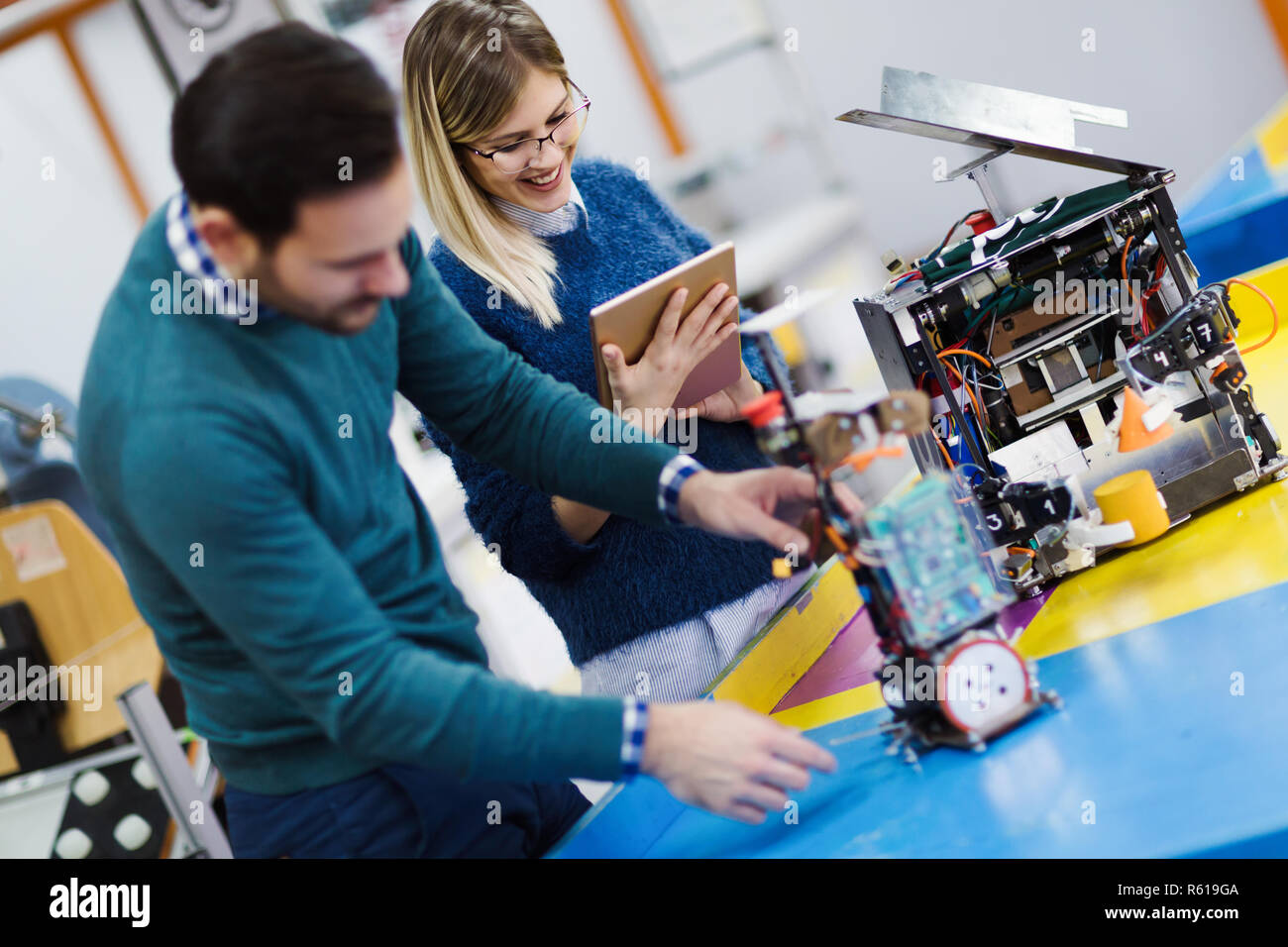 Young students of robotics working on project Stock Photo - Alamy