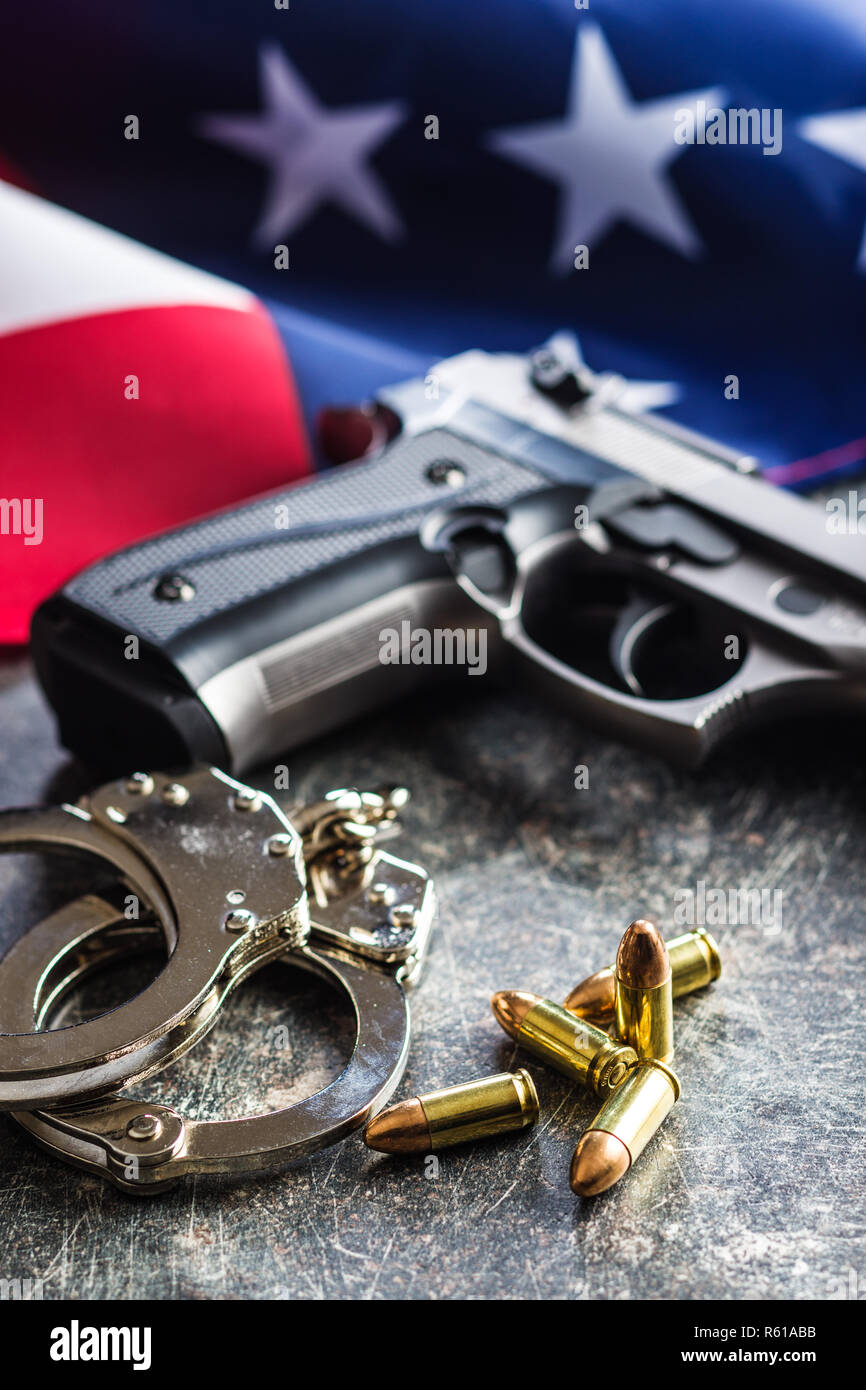Pistol bullets, handgun and handcuffs Stock Photo - Alamy