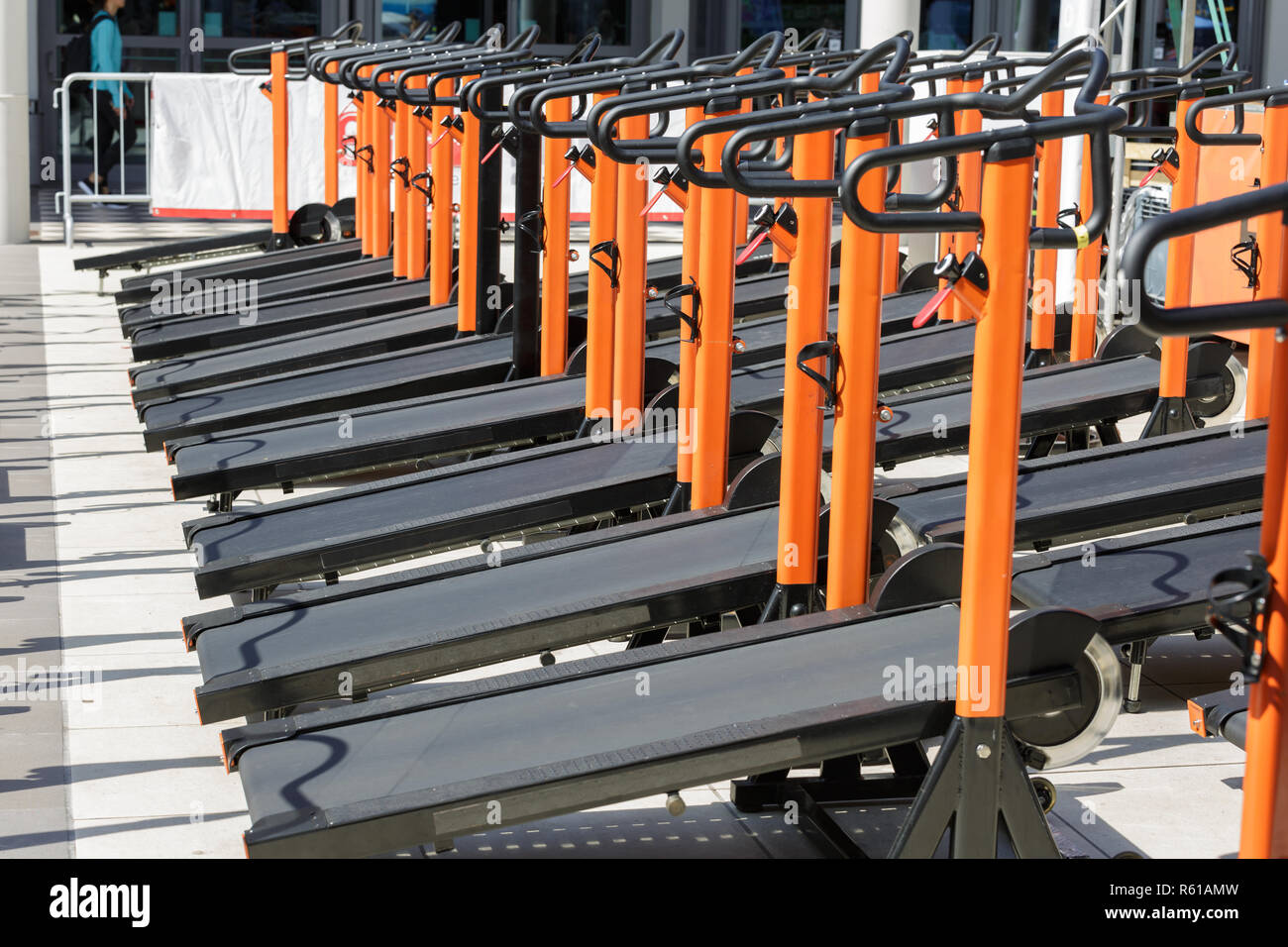 Group of Modern Orange Treadmill in Line in Fitness Center Stock Photo ...