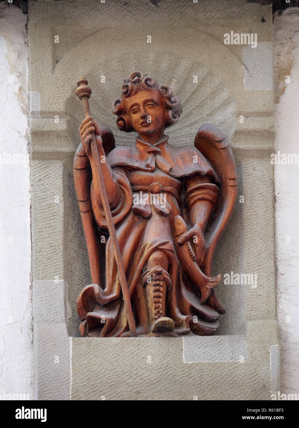 Archangel Raphael statue on the building facade in Lucerne, Switzerland ...