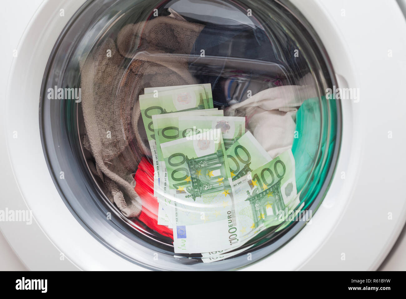 Money laundering in washing machine hi-res stock photography and images ...