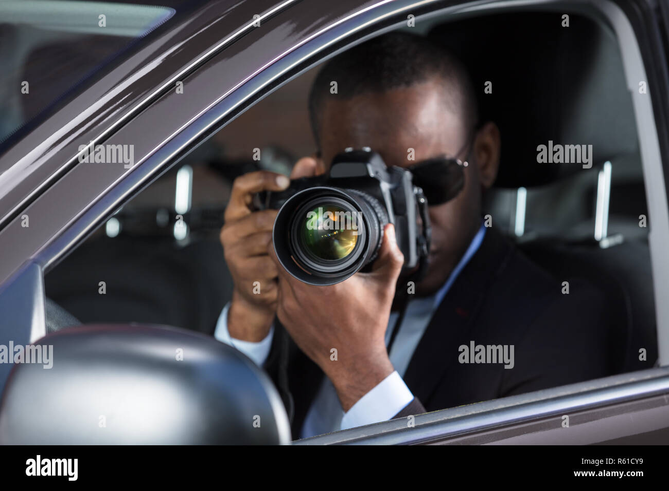 African Man With Camera Stock Photo - Alamy
