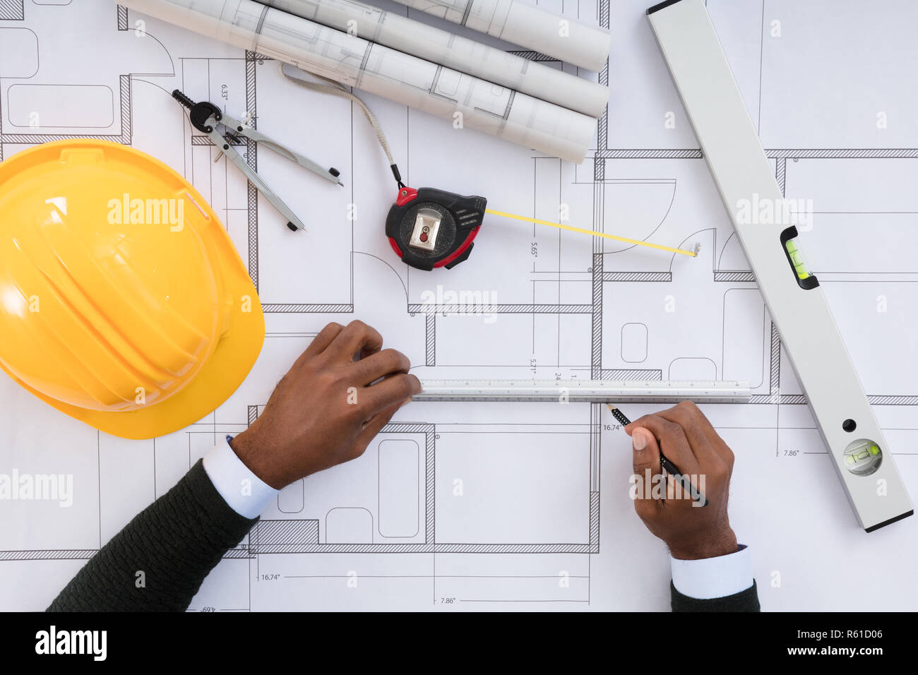 Architect Working On Blueprint Stock Photo - Alamy