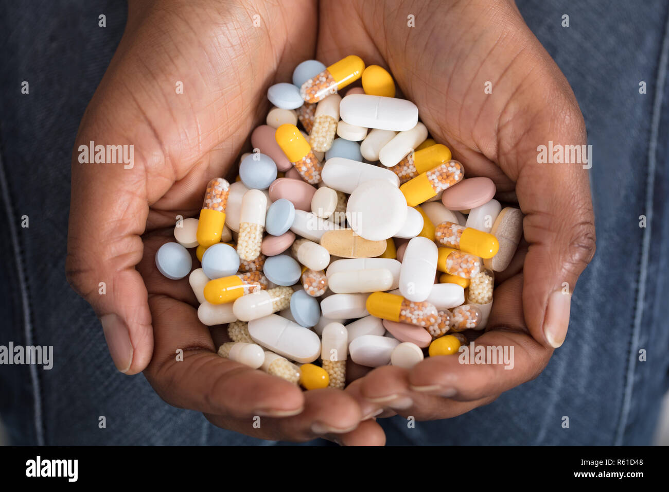 Human Hand With Variety Of Medicine Pills Stock Photo - Alamy