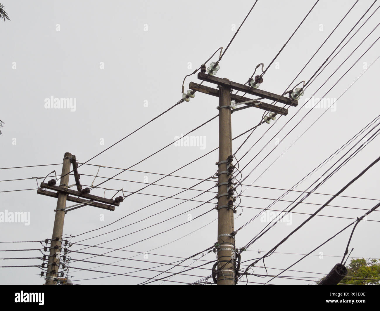 Posts with electric transmission wires on white background Stock Photo ...