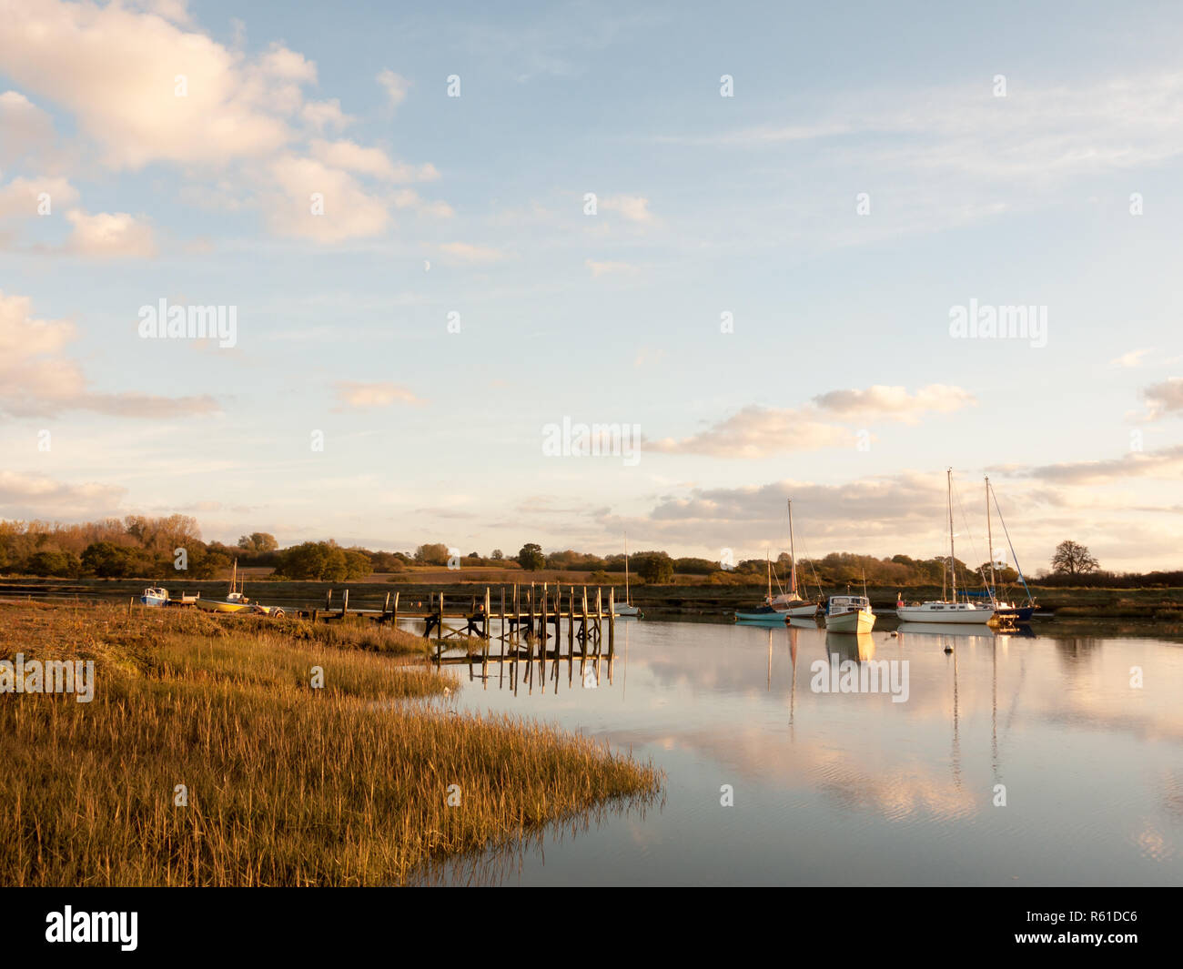 harbour pier dock wooden structure water outside boats lake river day ...