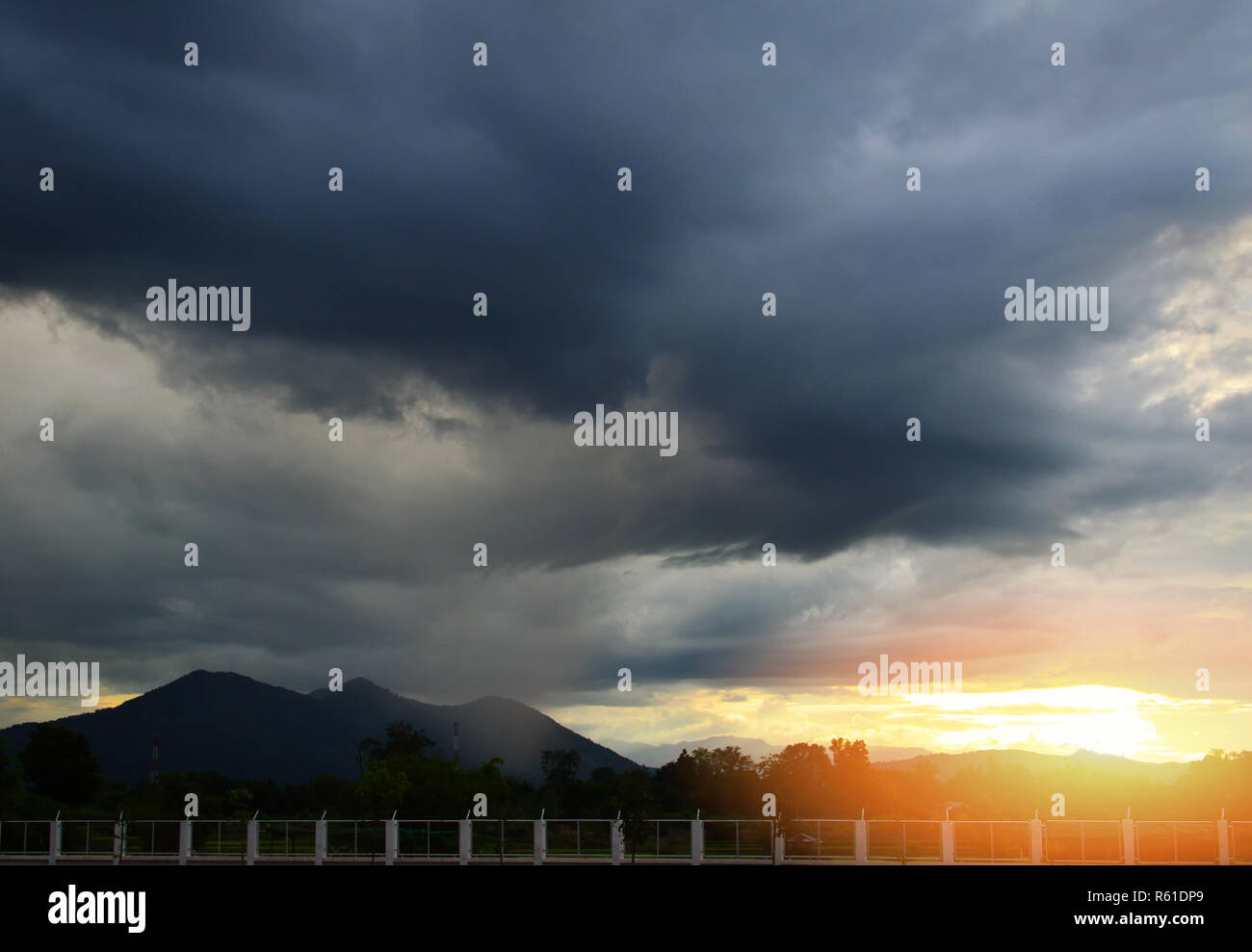 rainy storm season / it's raining on hill and storm clouds sunset on ...