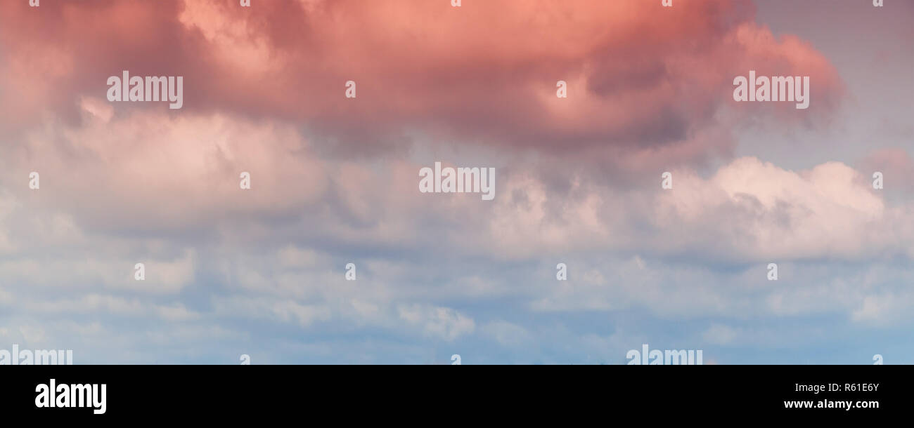 Colorful clouds are in sky at early evening, natural panoramic ...