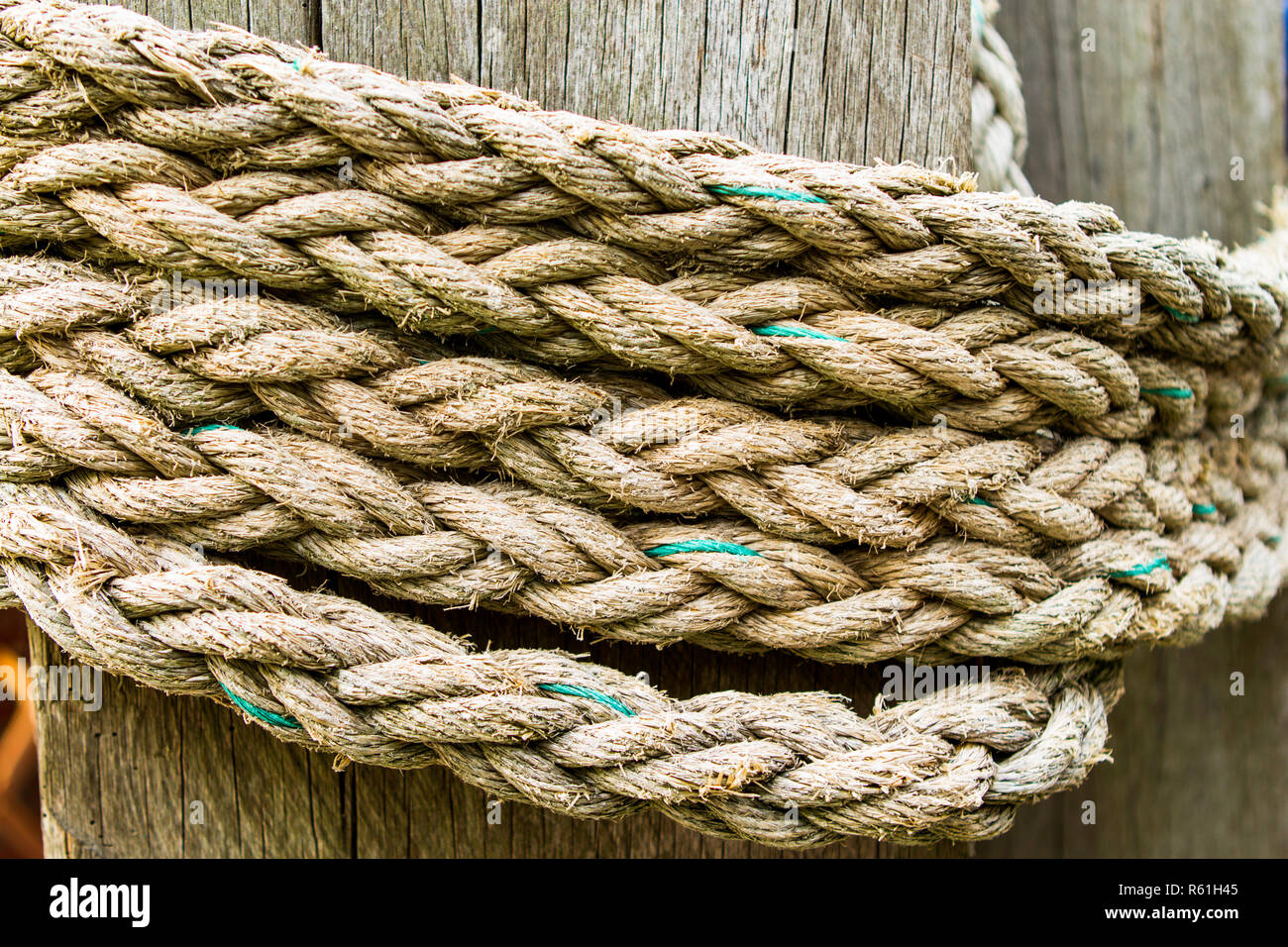 rough,old rope on weathered wooden surface Stock Photo - Alamy