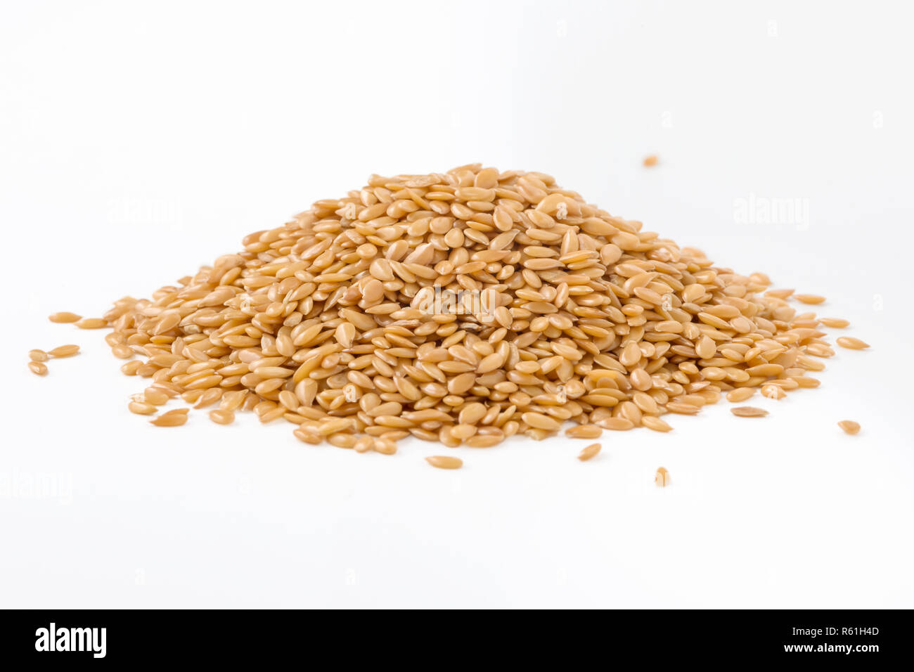 Golden flaxseed isolated on white background Stock Photo - Alamy