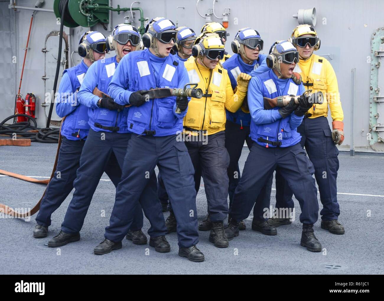PACIFIC OCEAN (May 6, 2017) Air Department Sailors advance fire hoses ...