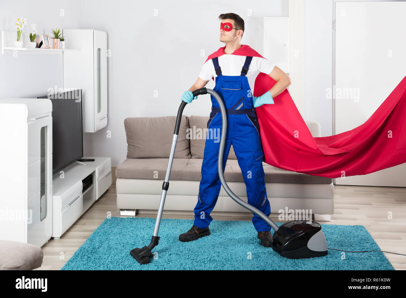 Janitor Cleaning Carpet With Vacuum Cleaner Stock Photo - Alamy