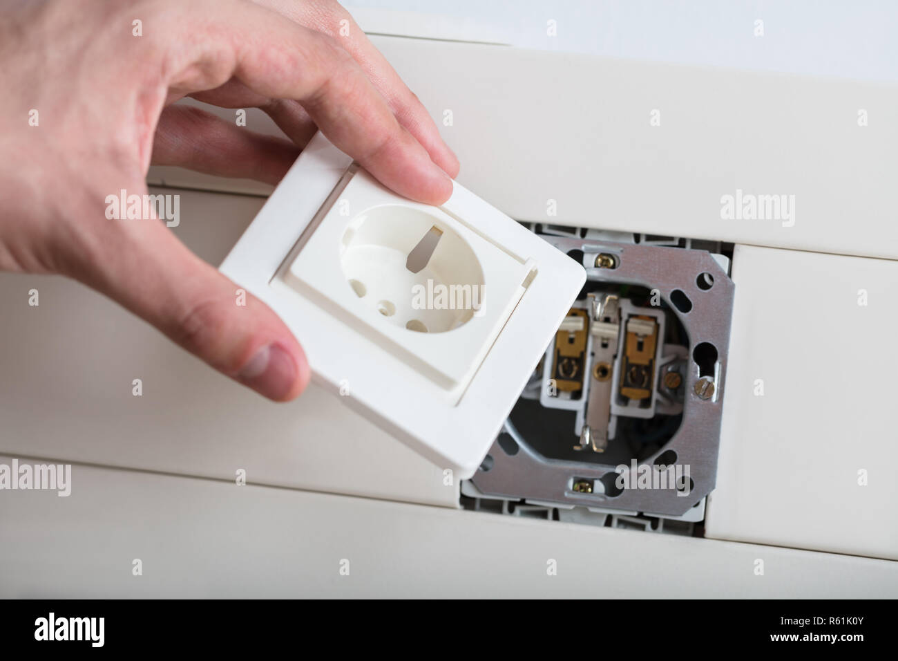 Technician Repairing Electrical Socket Stock Photo - Alamy