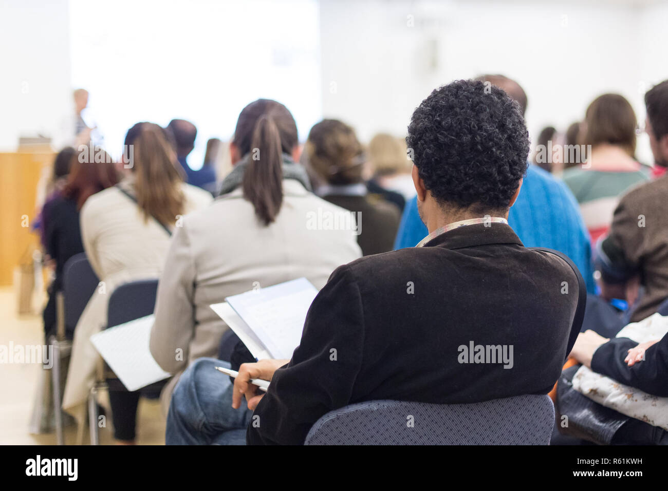 Woman giving presentation on business conference Stock Photo - Alamy