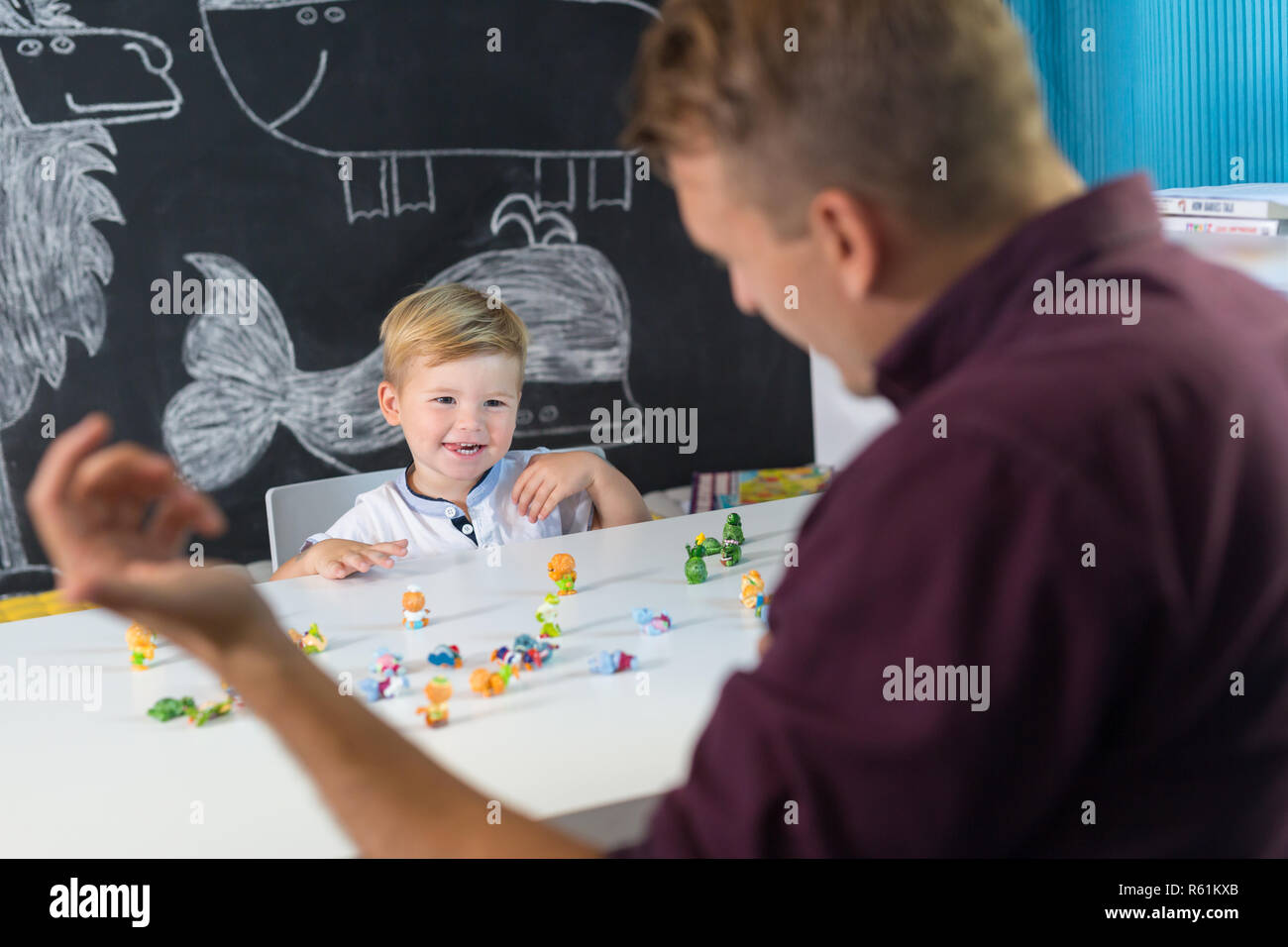 Cute little toddler boy at child therapy session Stock Photo - Alamy