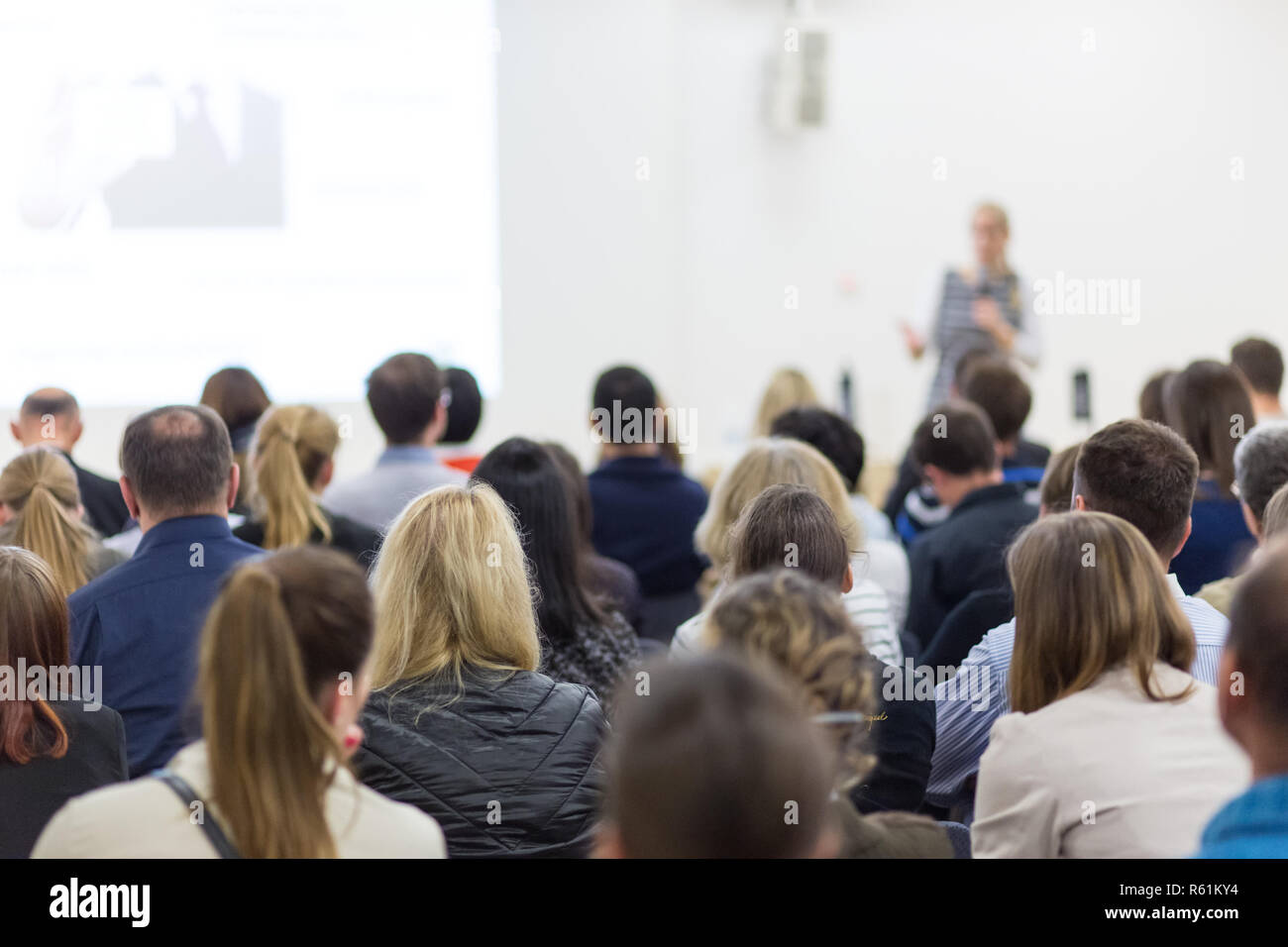 Woman giving presentation on business conference Stock Photo - Alamy