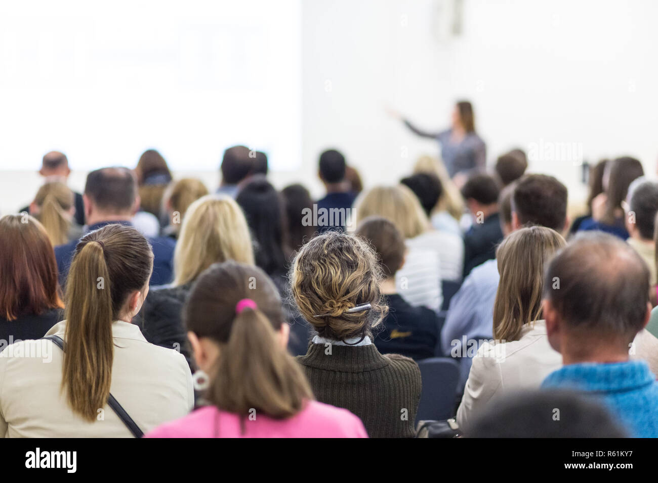 Woman giving presentation on business conference Stock Photo - Alamy