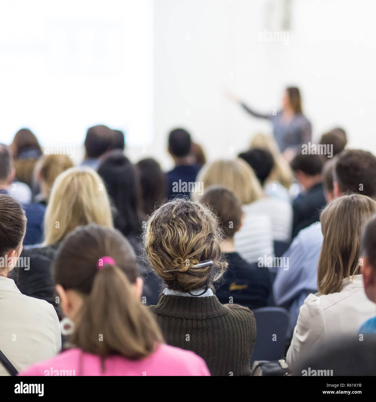 Woman giving presentation on business conference Stock Photo - Alamy
