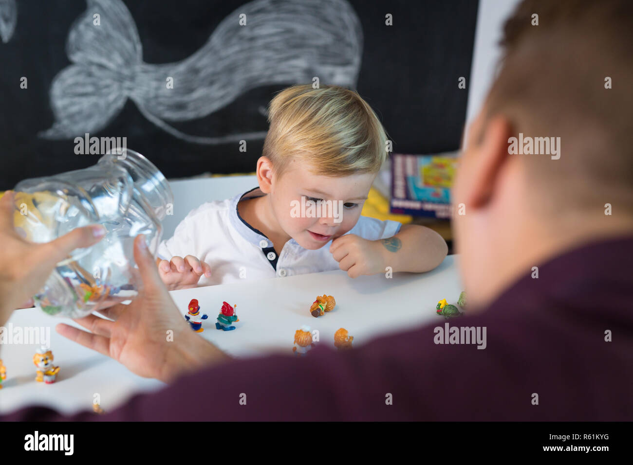 Cute little toddler boy at child therapy session Stock Photo - Alamy