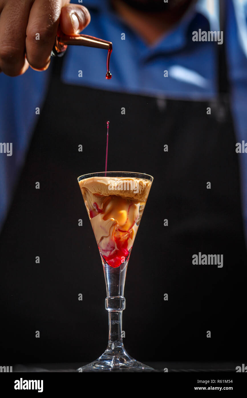 Bartrender makes Brain cocktail Stock Photo - Alamy