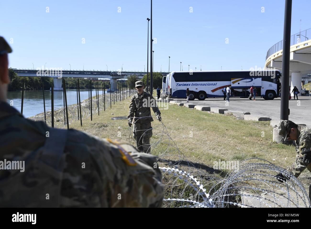 U.S. Army Soldiers with the 541st Sapper Company apply concertina wire ...