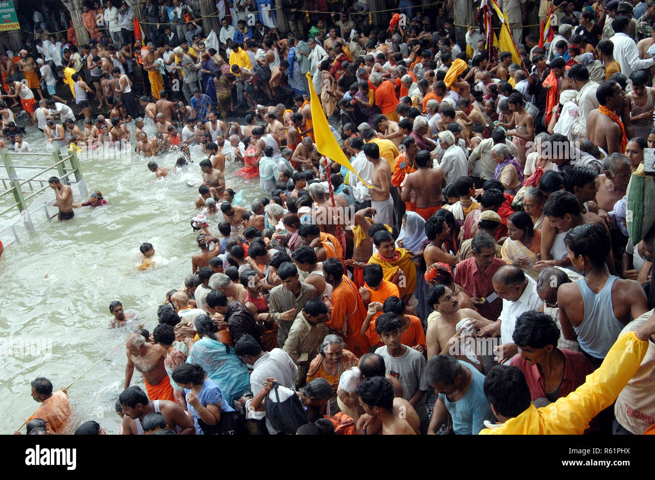 Devotees take a holy dip during the Kumbh Mela 2003 at Trimbakeshwar ...