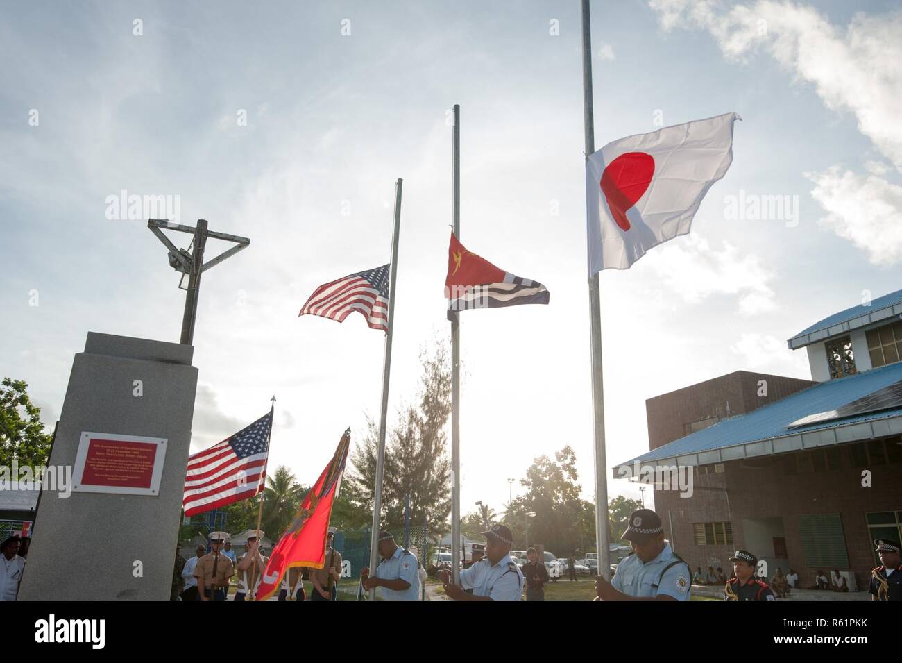 The flags of the United States, Republic of Kiribati and Japan are set ...