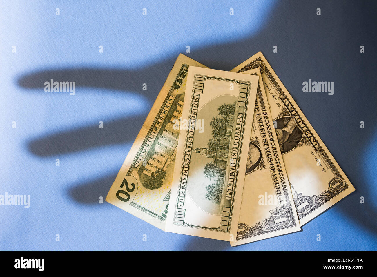 Shade From A Hand On Money Stock Photo - Alamy