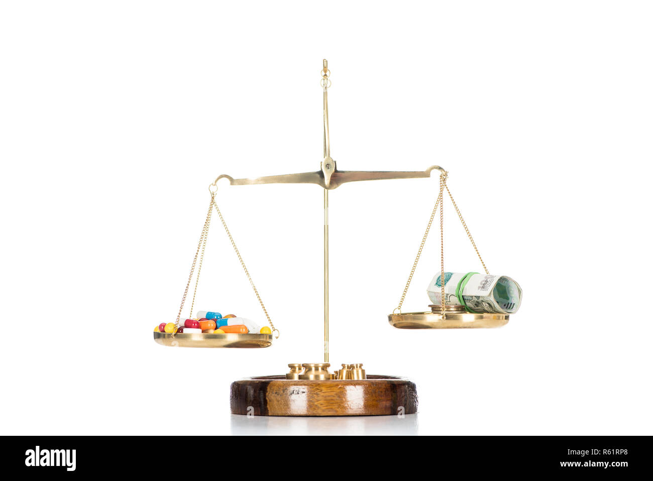 Pills money scales hi-res stock photography and images - Alamy