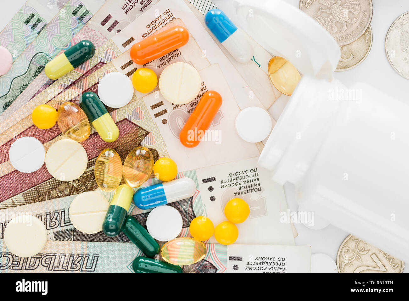 top view of various colorful pills and russian rubles on surface Stock ...