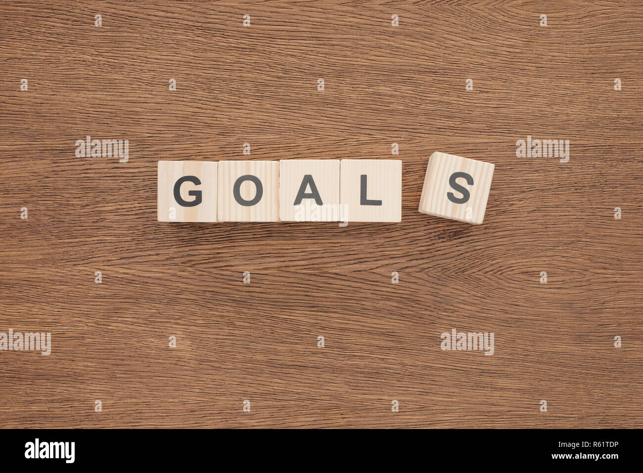 'goals' word made of wooden blocks on wooden tabletop, goal setting ...