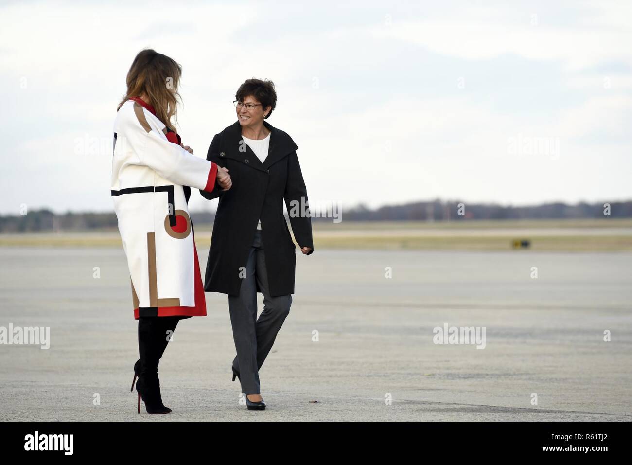 First Lady of the United States Melania Trump, (left) shakes hands with ...