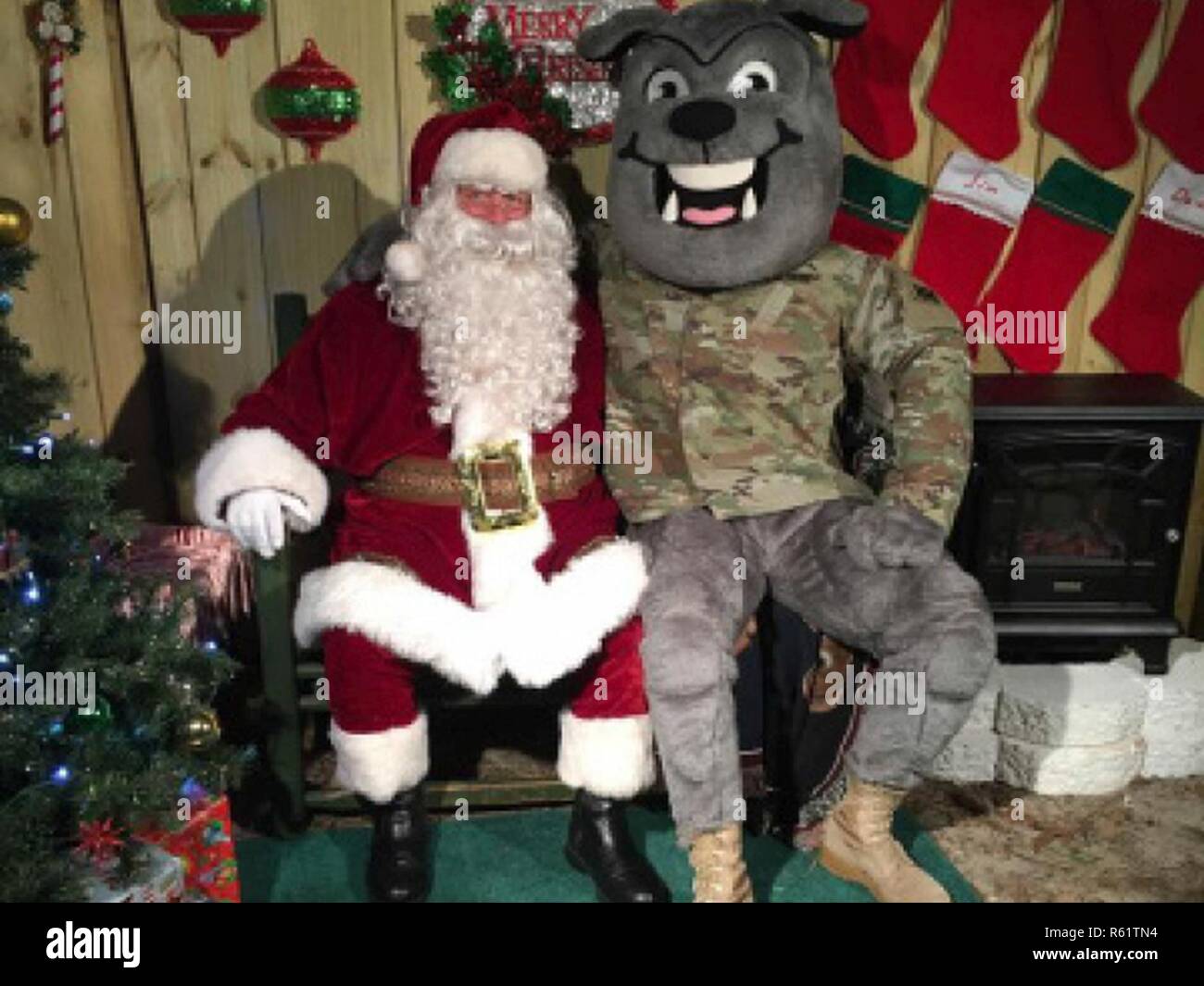 Rocky the Bulldog, 3rd Infantry Division mascot, poses with Santa at ...