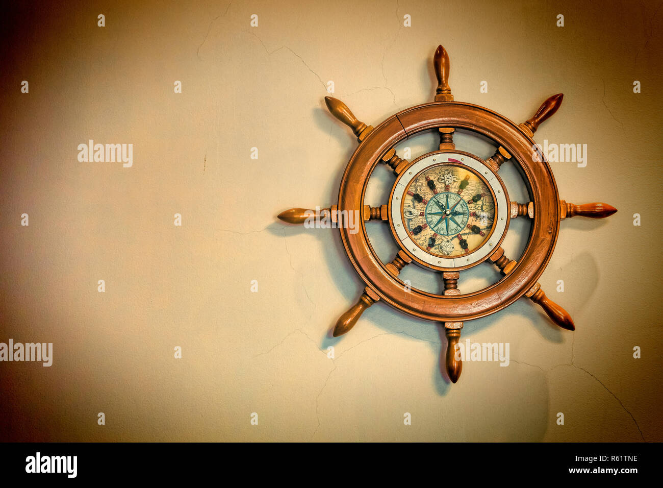 Concept: travel, sea navigation. Ship's nautical steering wheel and old ...