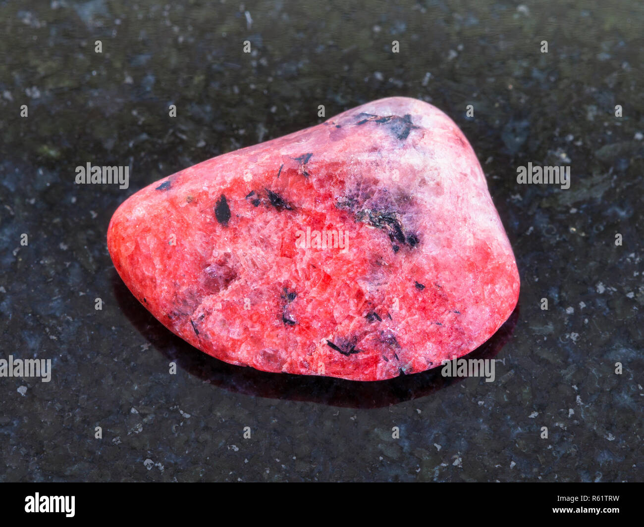 polished red Agate gemstone on dark background Stock Photo - Alamy